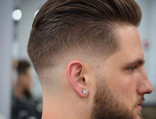 Thick Brushed Back Low Fade Hairstyles For Men